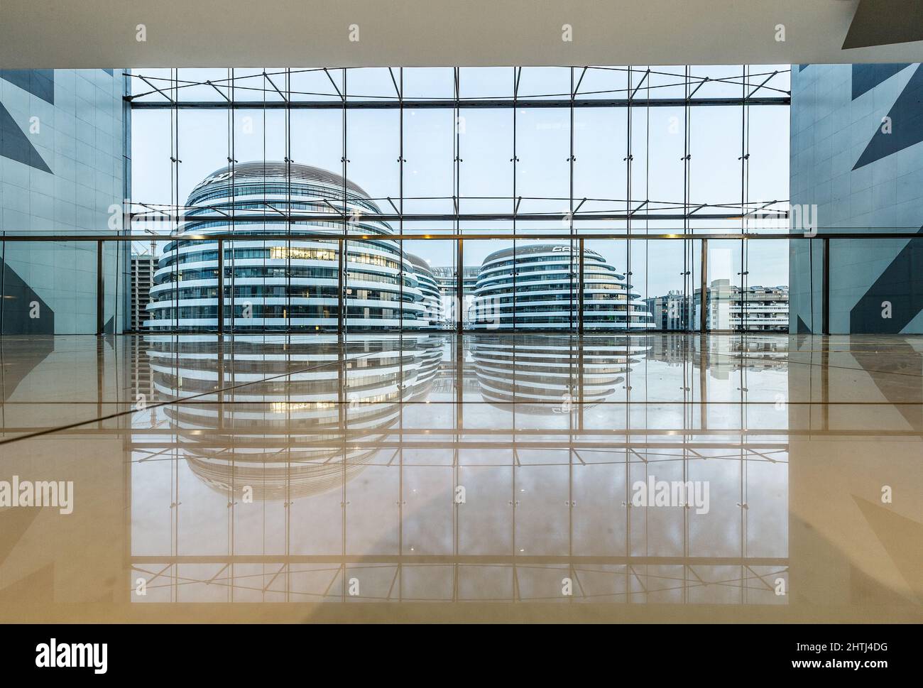 Fascinating shot of Galaxy SOHO Office Building behind the glass ...