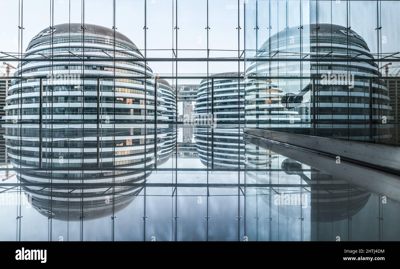 Fascinating shot of Galaxy SOHO Office Building behind the glass ...
