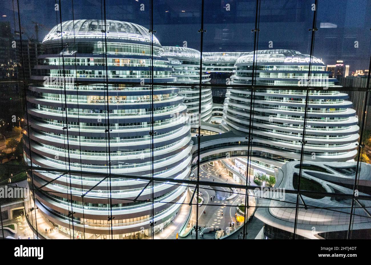 Fascinating shot of Galaxy SOHO Office Building behind the glass ...