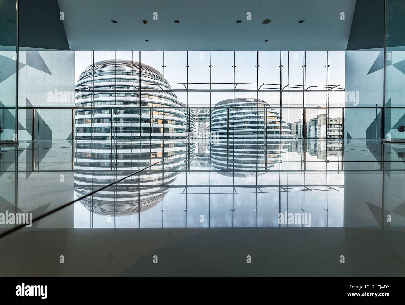 Fascinating shot of Galaxy SOHO Office Building behind the glass ...