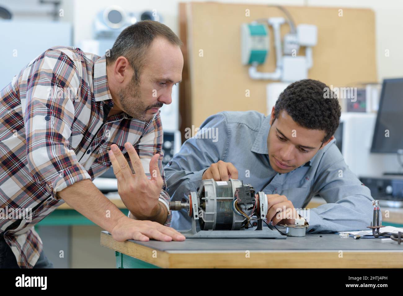 Man fixing engine under hi-res stock photography and images - Alamy