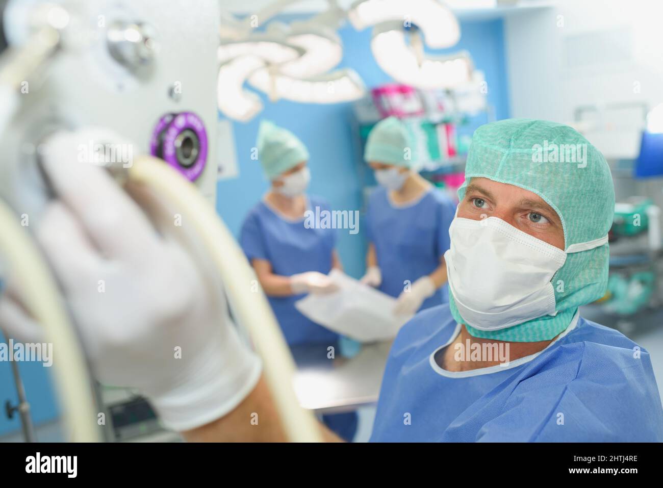 surgery assistant perfusionist operating a modern heart lung machine ...