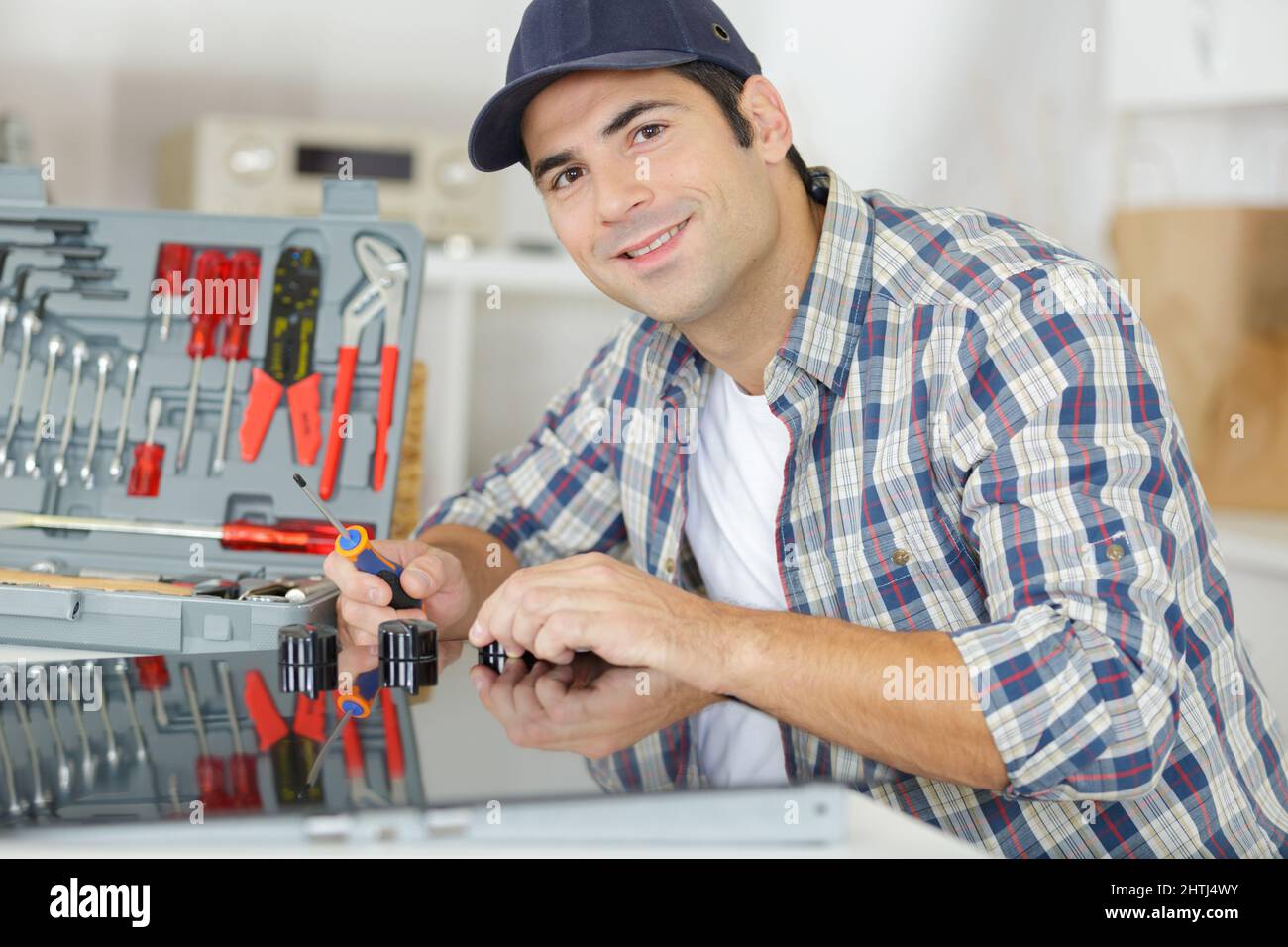 mechanic takes the tool from the tool box Stock Photo - Alamy