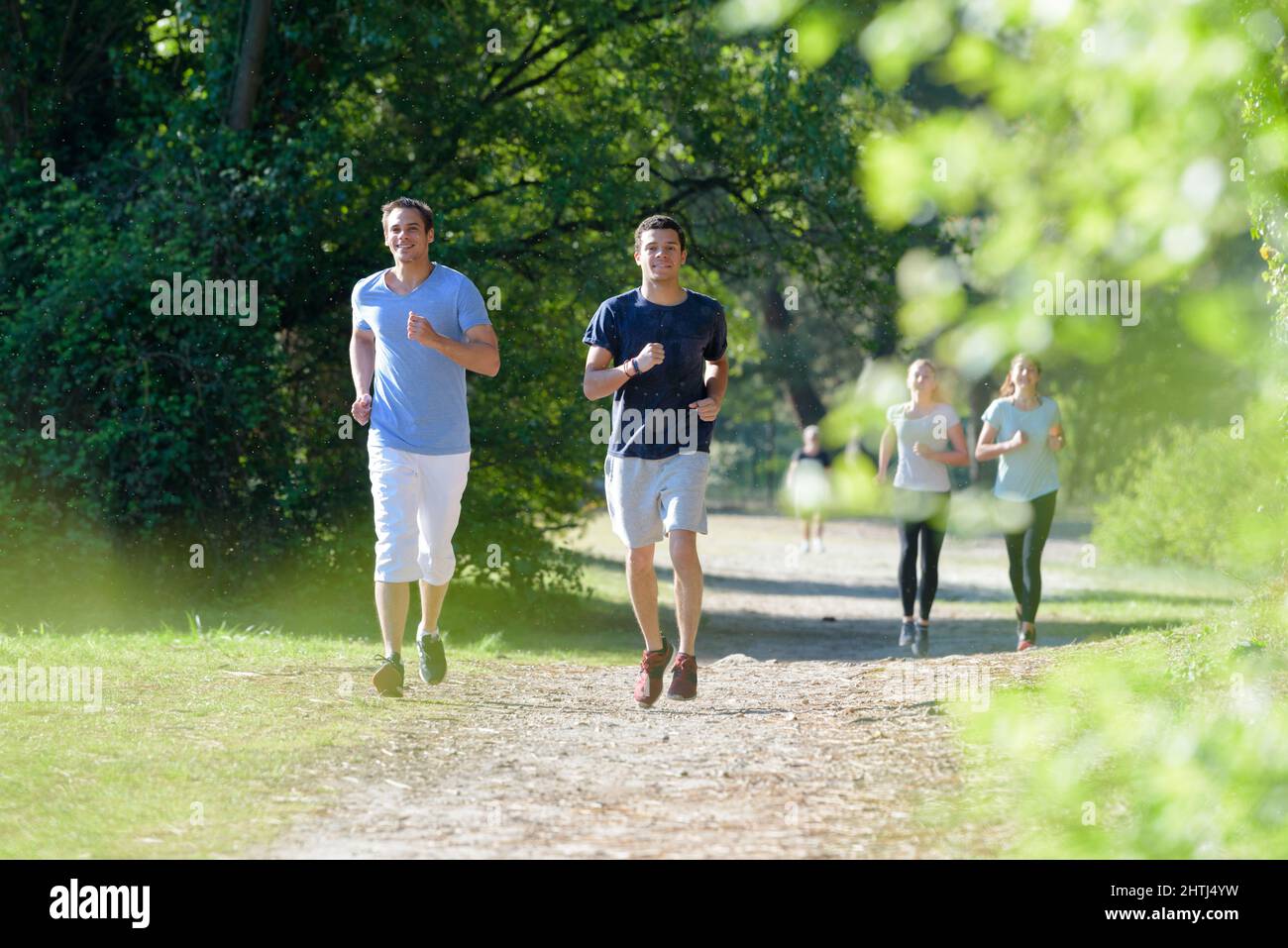 jogging group doing daily routine Stock Photo - Alamy