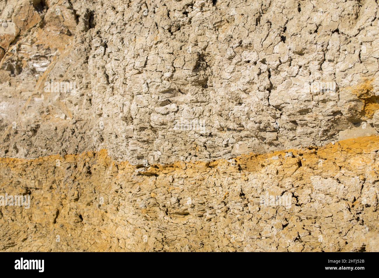 Steep blue clay slopes, with flaking debris forming scree on limestone ...