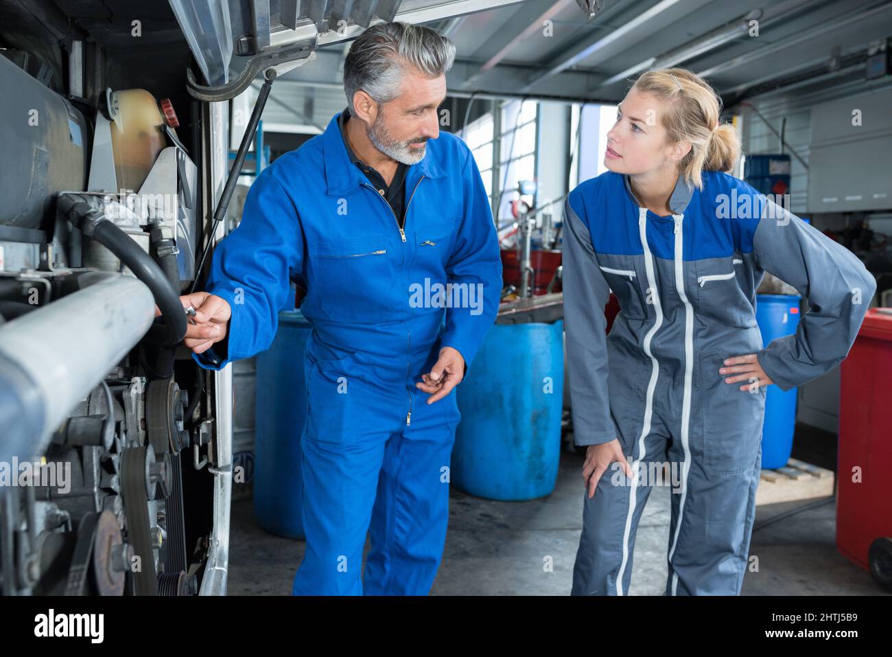 public transport maintenance mechanic talking Stock Photo - Alamy