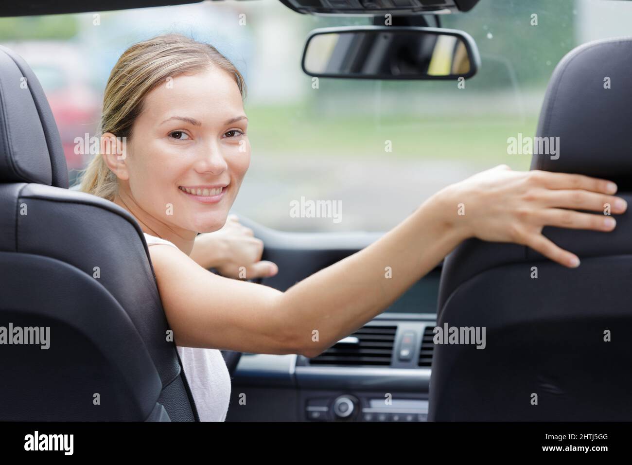 Female reversing car hi-res stock photography and images - Alamy