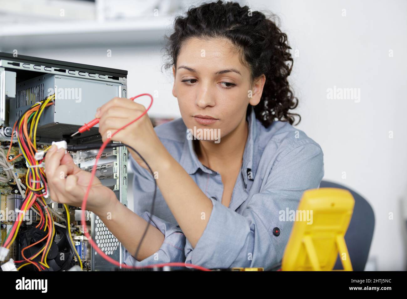 a woman testing a motherboard Stock Photo - Alamy