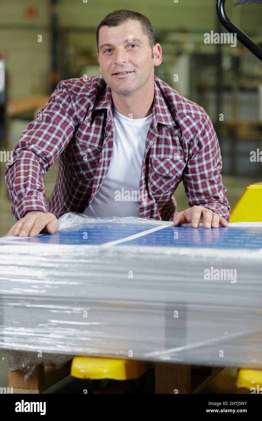 a man is pushing a trolley cart Stock Photo - Alamy