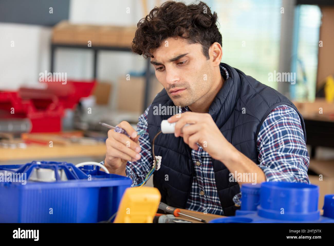 Male tech repairs electronic equipment hi-res stock photography and ...