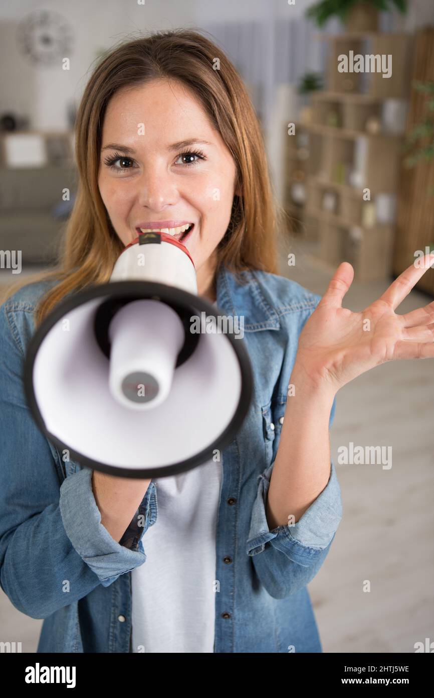 Lady speaking into megaphone hi-res stock photography and images - Alamy