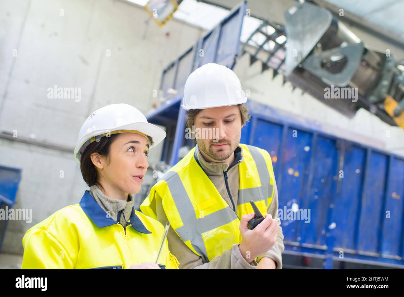 male and female engineers working in a power plant Stock Photo - Alamy