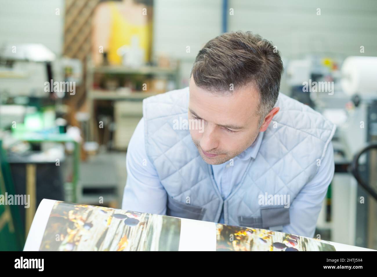print operator checking color managament quality Stock Photo - Alamy