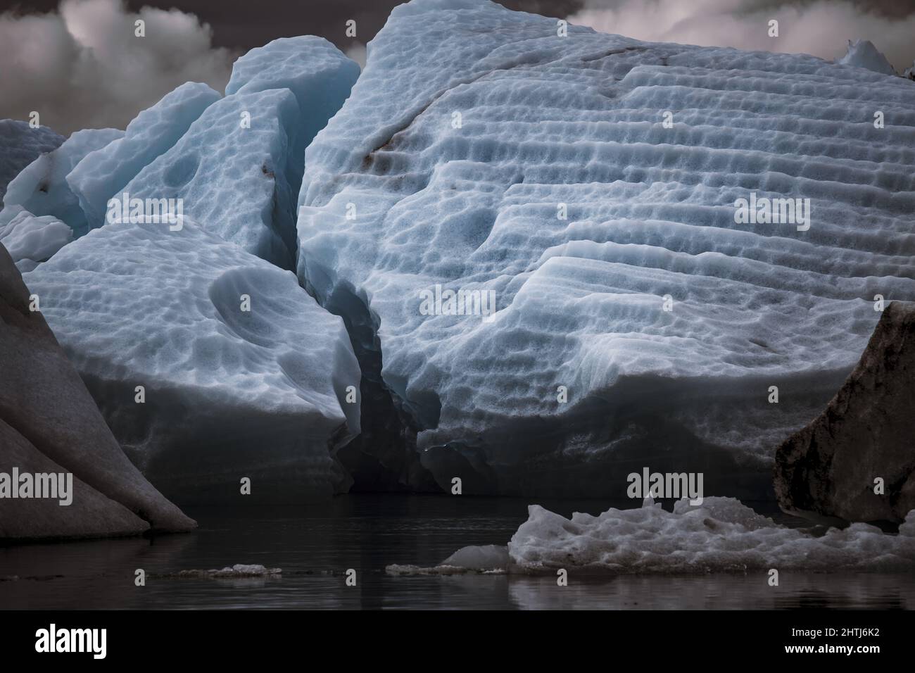 Crack in an Iceberg floating in the sea Stock Photo - Alamy