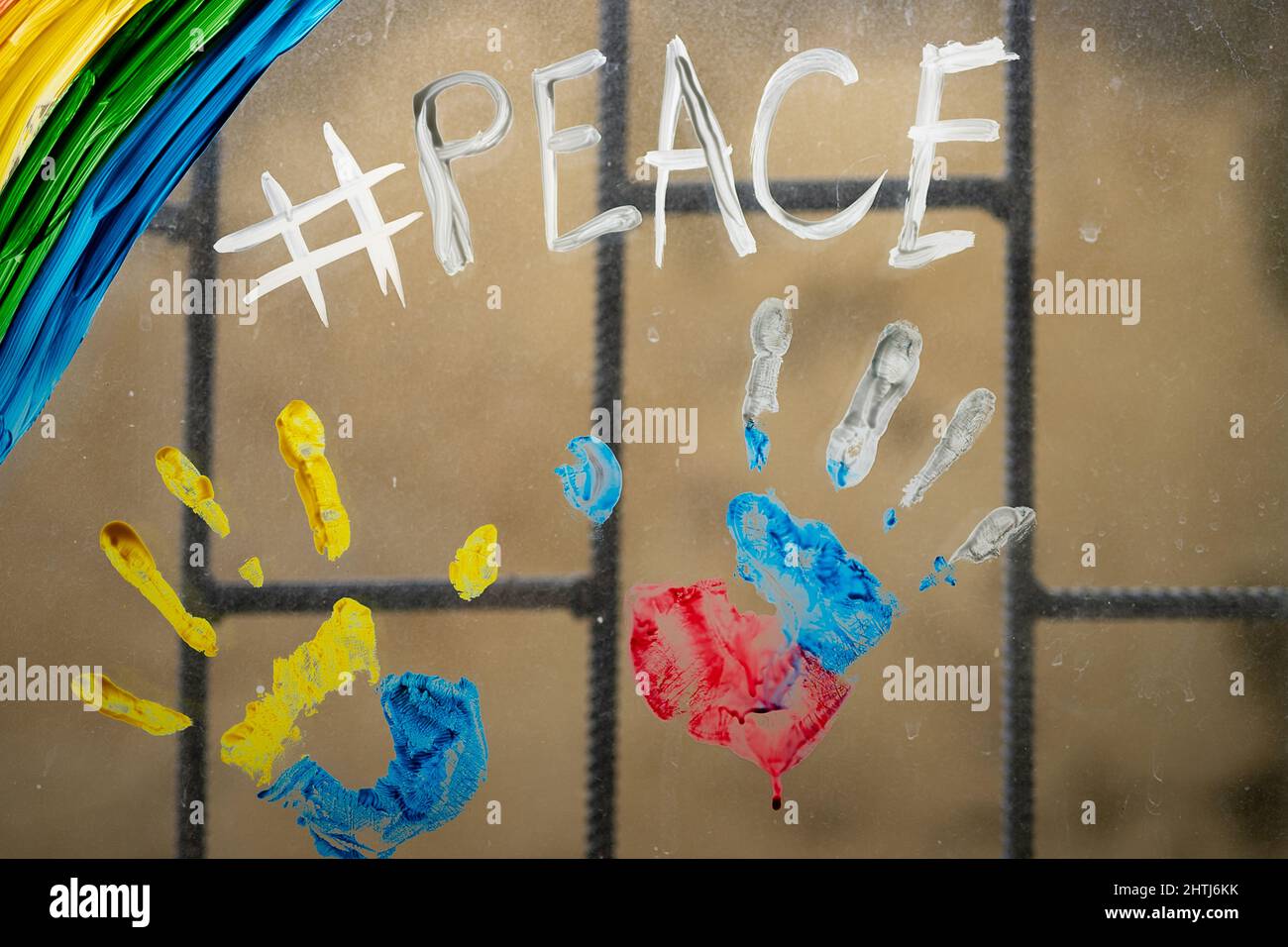 Close up photo of peace inscription and hands prints in paint of Russia ...