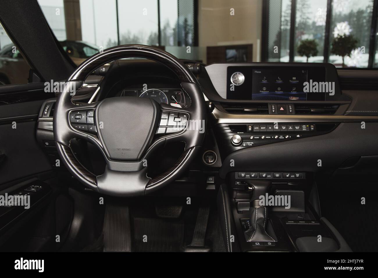 Car interior luxury steering wheel. Dashboard, climate control, display ...