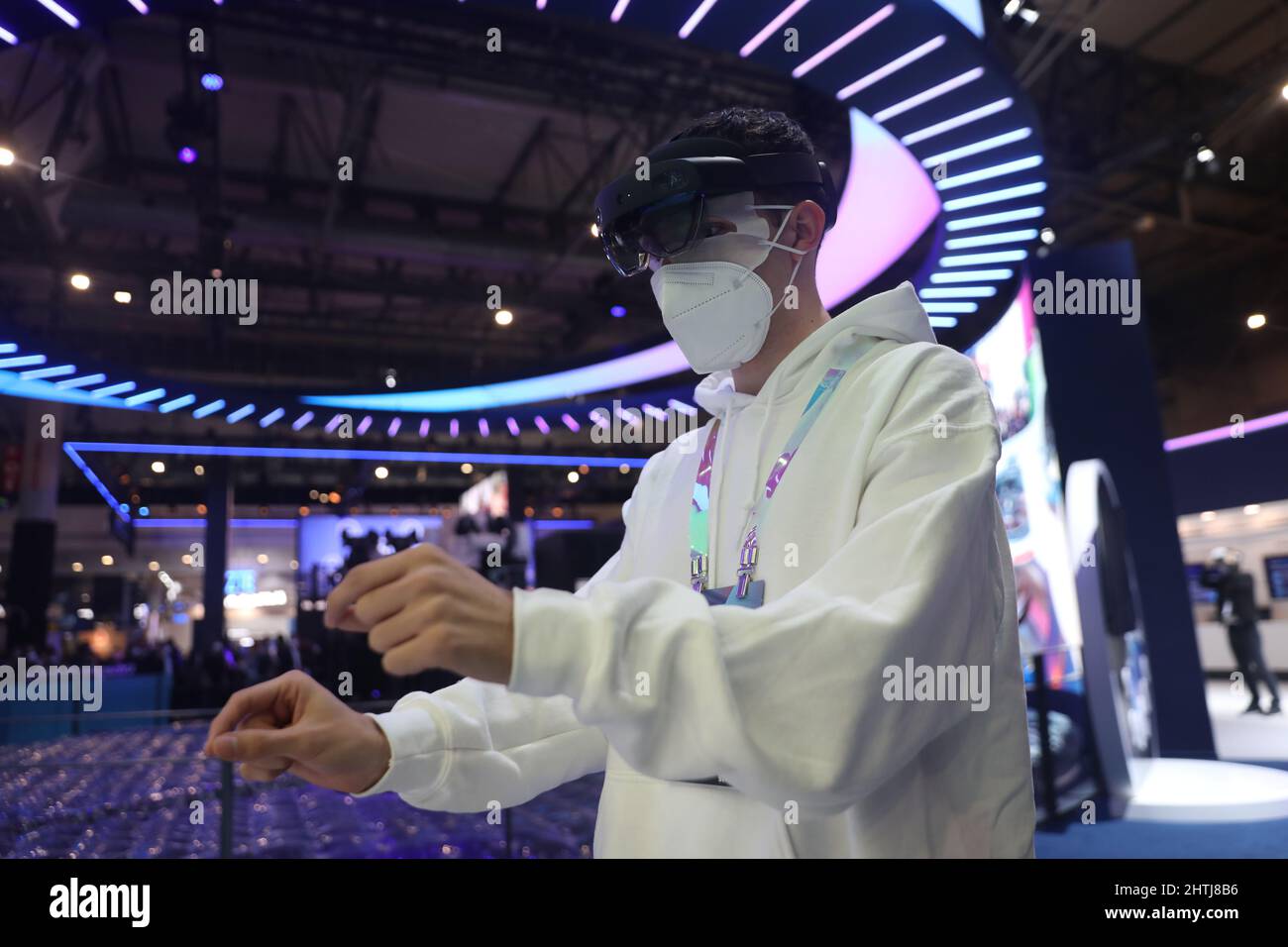 Barcelona, Spain. 28th Feb, 2022. A staff member wearing virtual ...