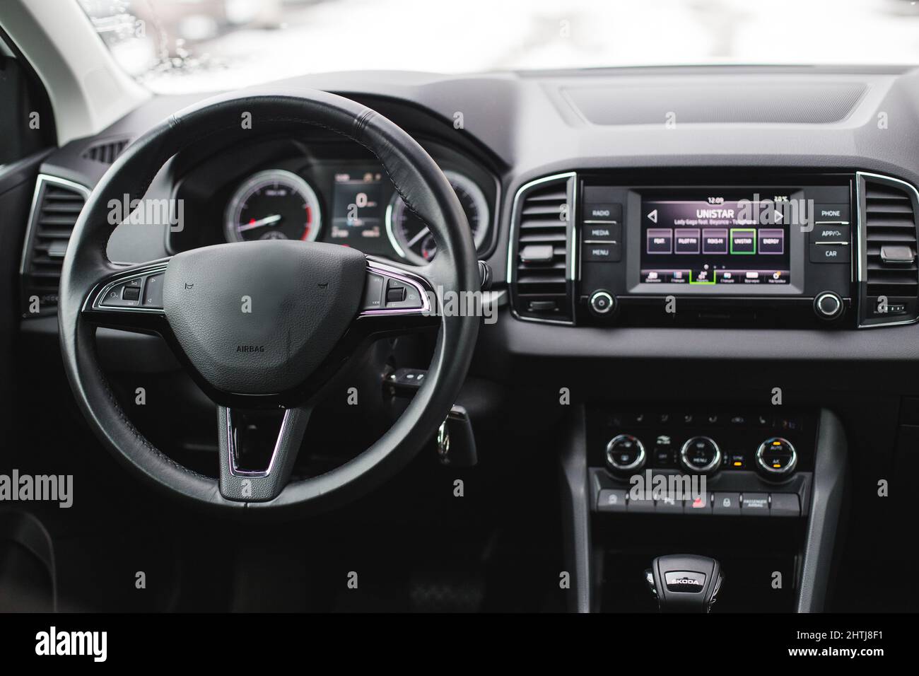 Car interior luxury steering wheel. Dashboard, climate control, display ...