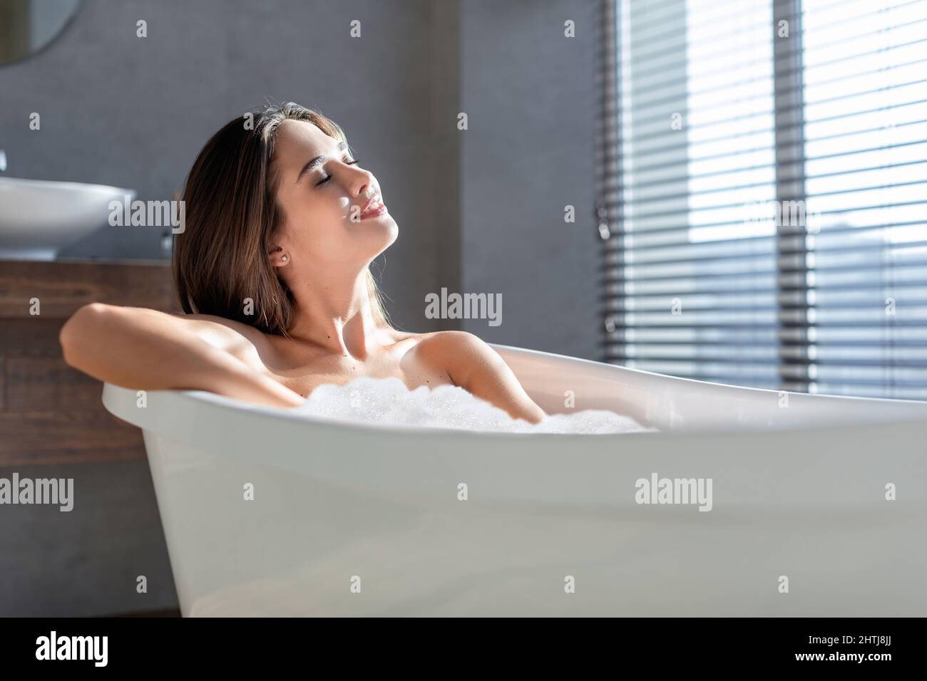 Closeup Shot Of Beautiful Lady Relaxing In Bathtub Filled With Foam ...