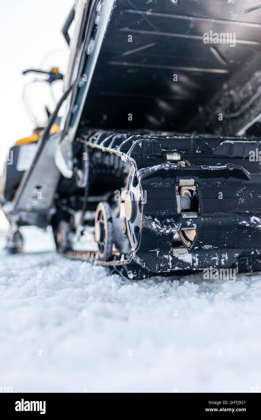 The back of the snowmobile in winter. Riding in the snow on a ...