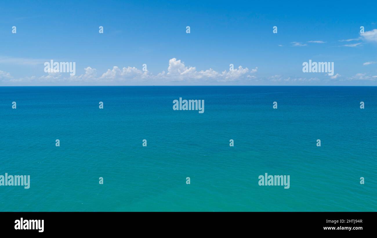 Aerial view of a blue sea surface water texture background and sky ...