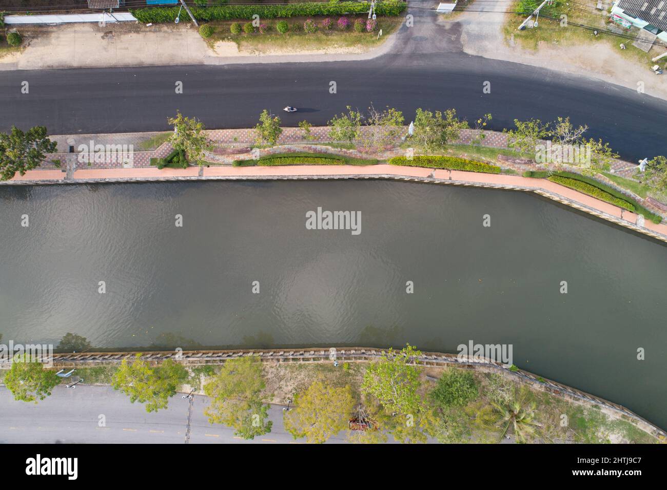 Aerial view canal near the road Top down view of nature in summer day ...