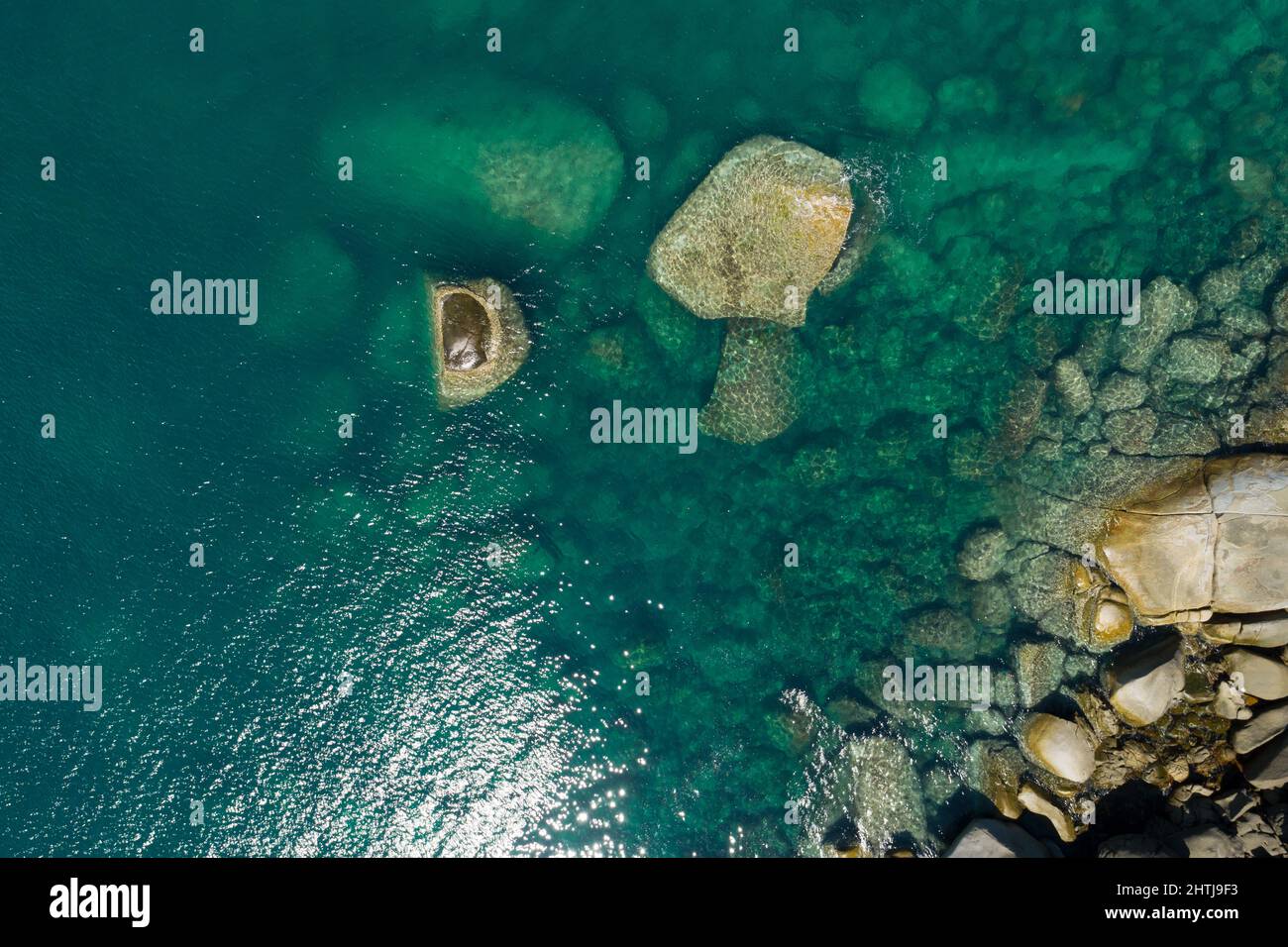 Aerial view Top down seashore rocks sea surface in sunny day Good ...