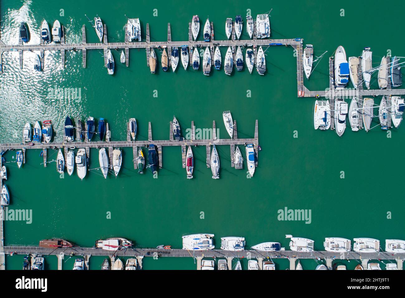 Aerial View Top down Drone shot of Yacht and sailboat parking in marina ...