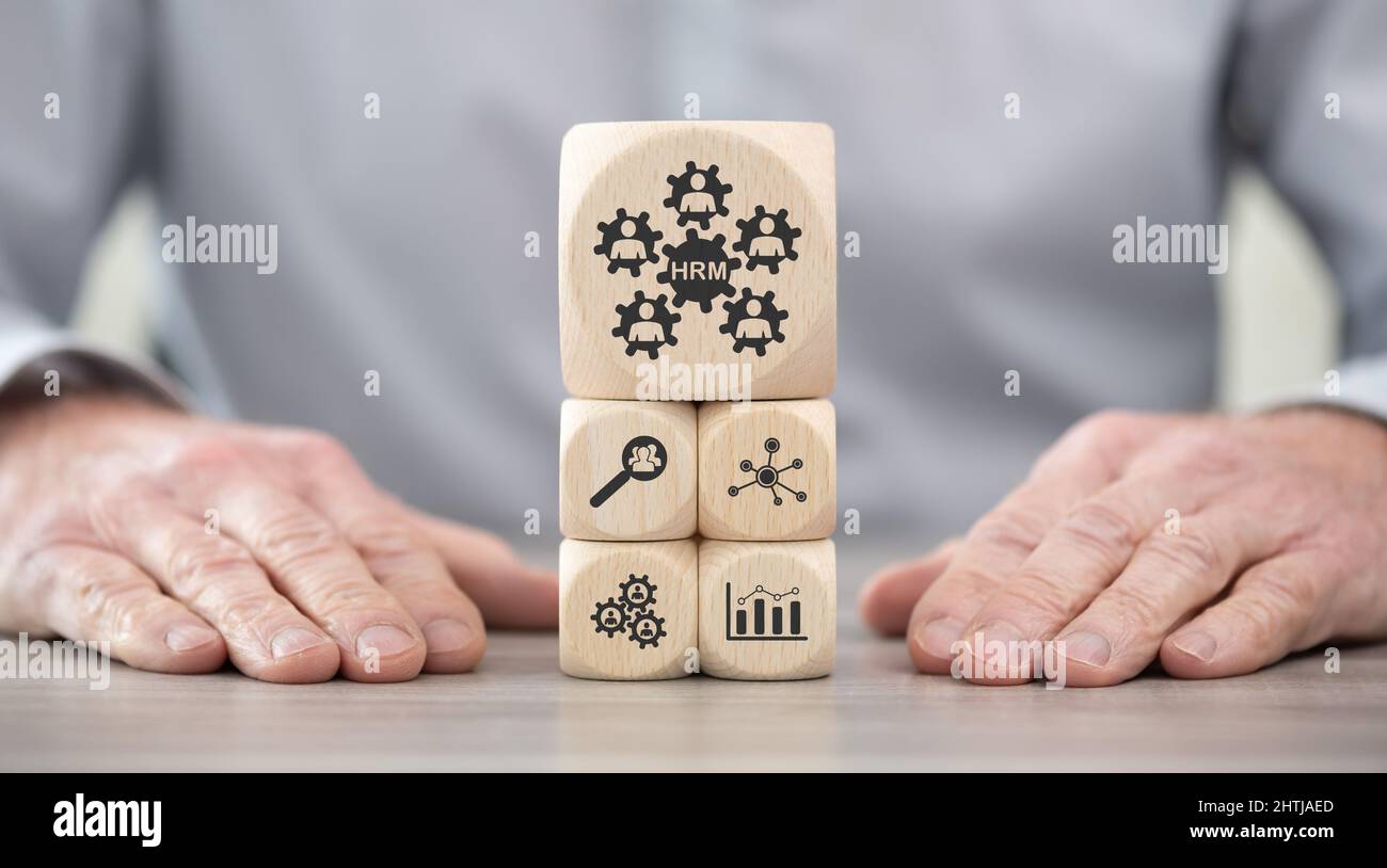 Wooden blocks with symbol of hrm concept Stock Photo - Alamy