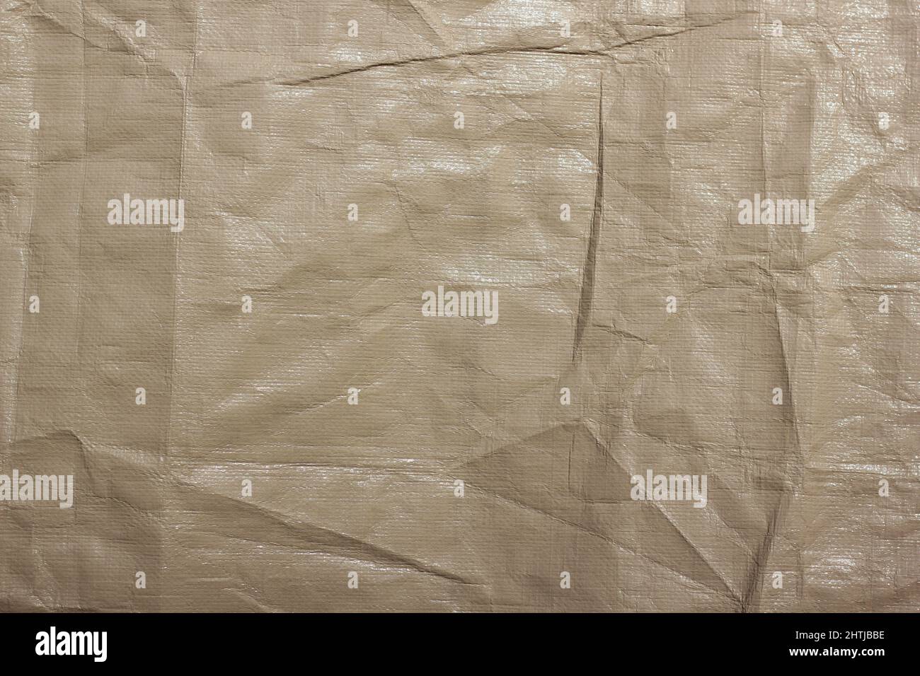 Full frame of beige plastic tarp stretched over a flat surface Stock ...
