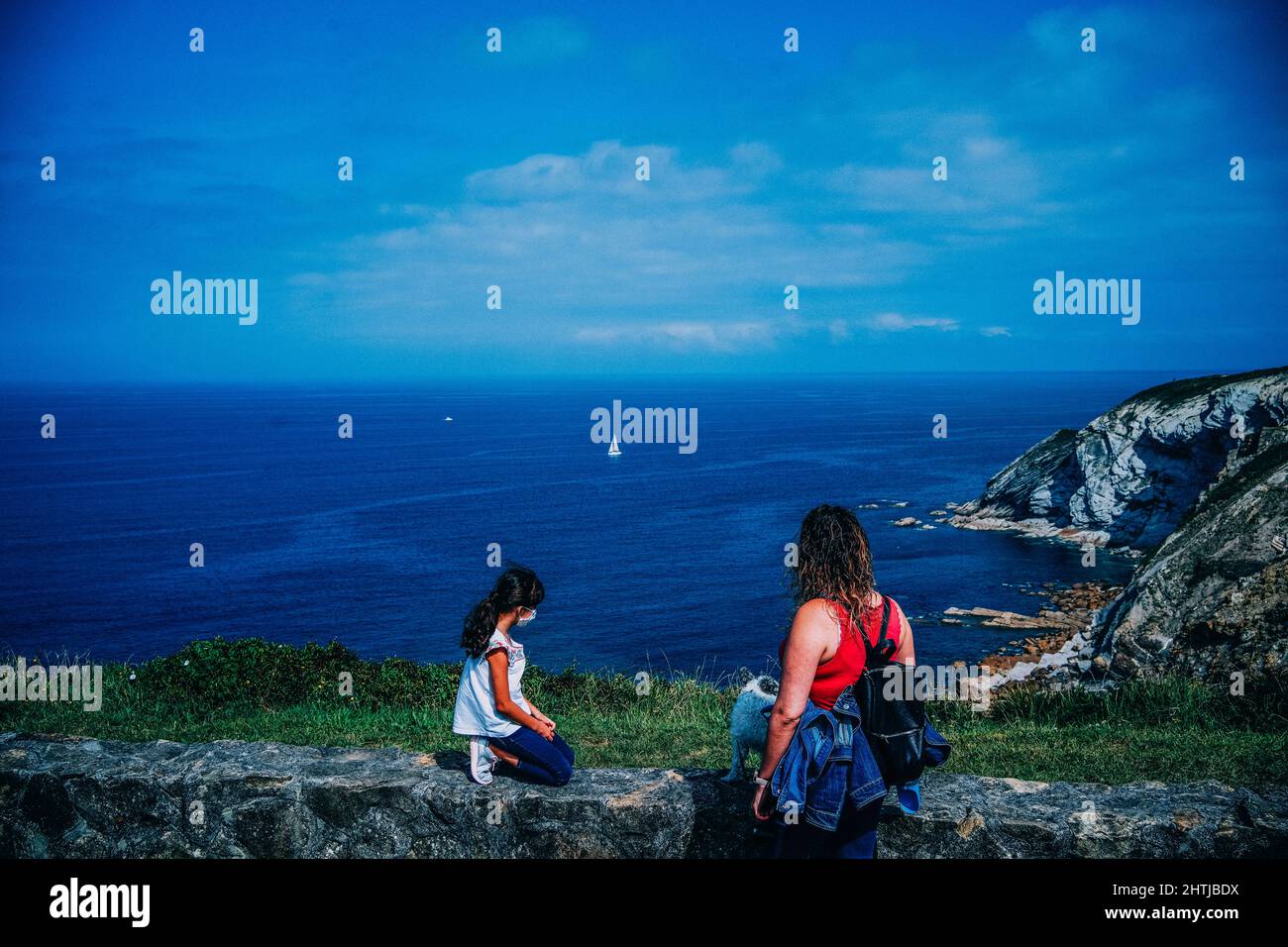 mother and daughter watching the sea Stock Photo - Alamy