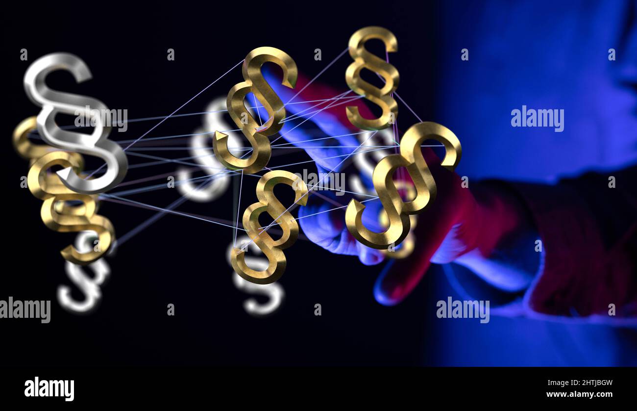 Hand controlling some illustrative golden paragraph signs Stock Photo ...