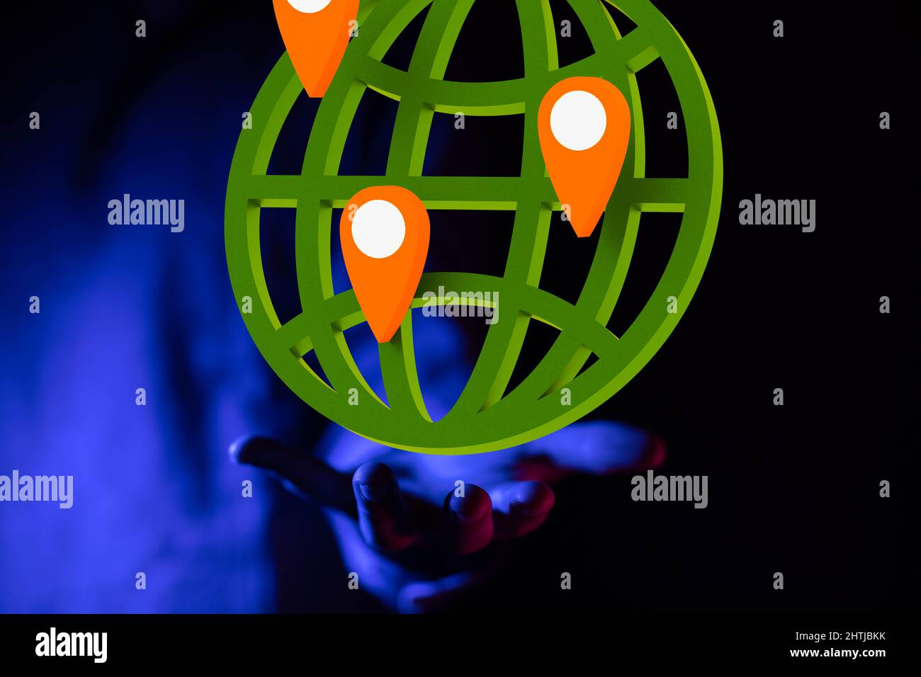 Hand holding an illustrative 3D world sign with locations Stock Photo ...