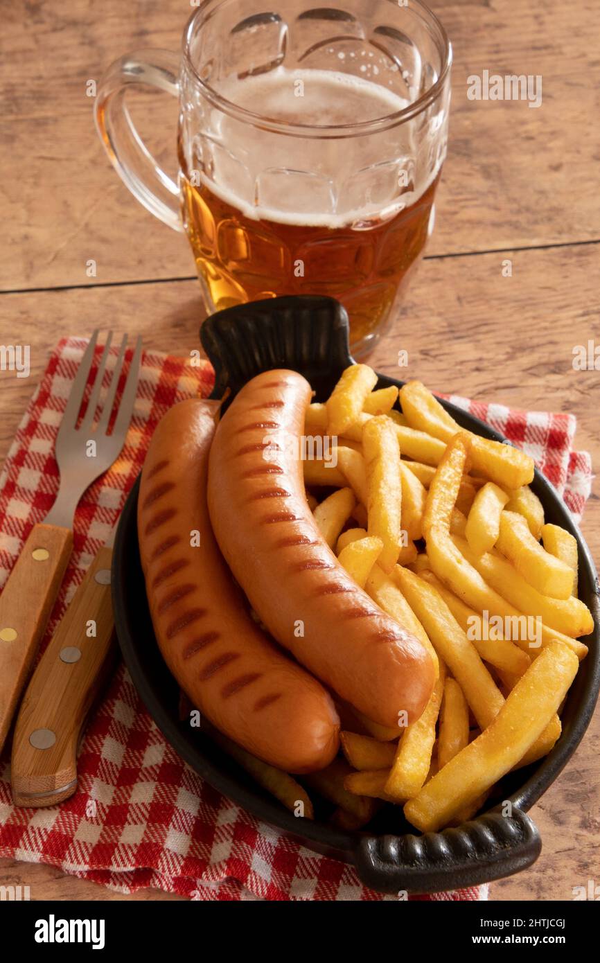 grilled frankfurter dish with fries and beer Stock Photo - Alamy