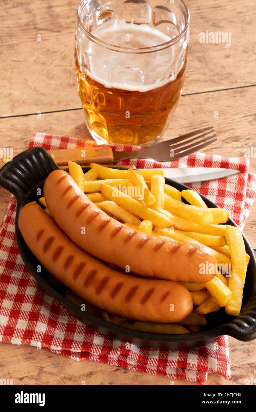 grilled frankfurter dish with fries and beer Stock Photo - Alamy