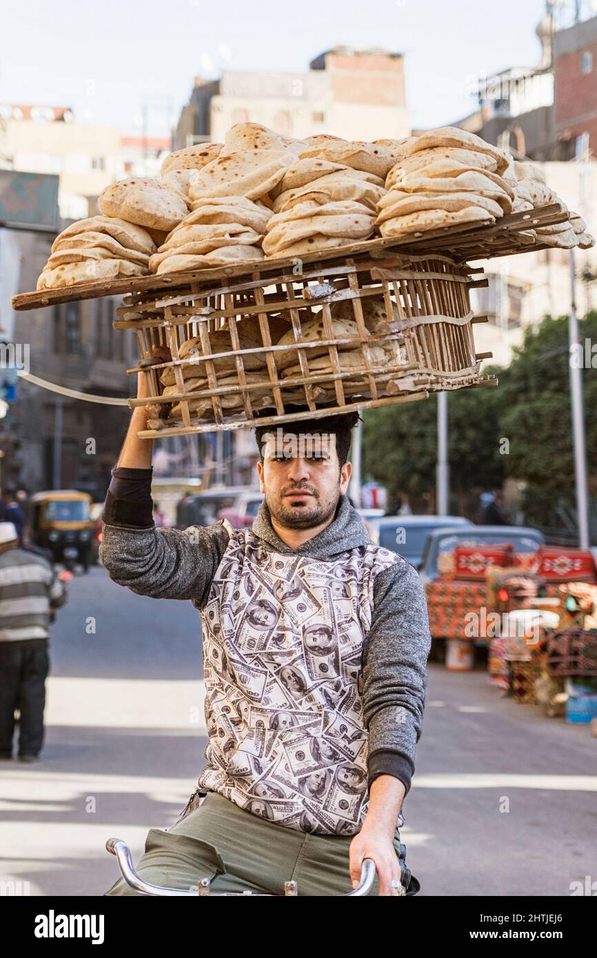 Cairo, Egypt - January 11, 2022: Ethnic guy delivering Egyptian Pita ...