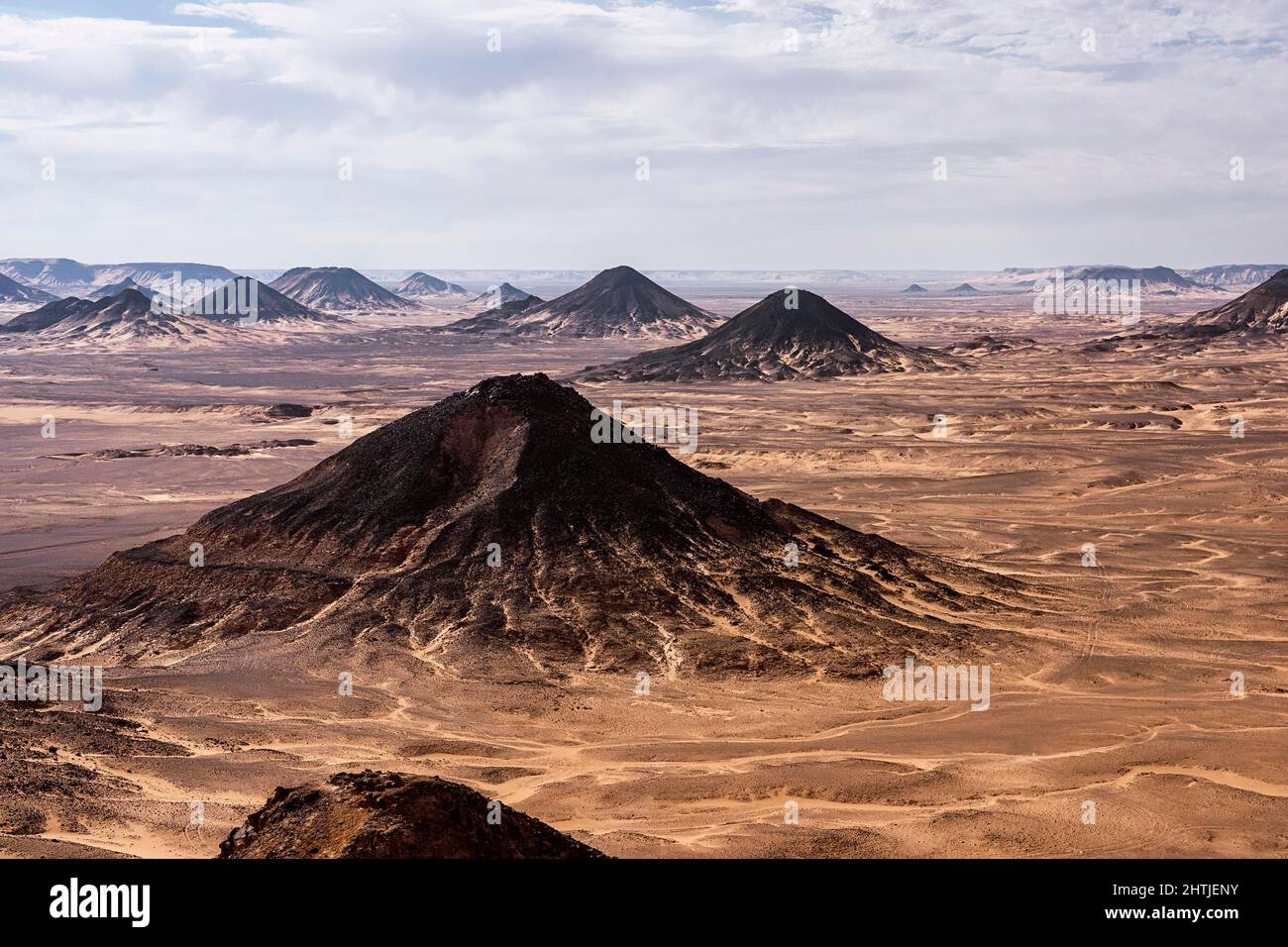 Endless famous arid black desert with long road and abundance of ...
