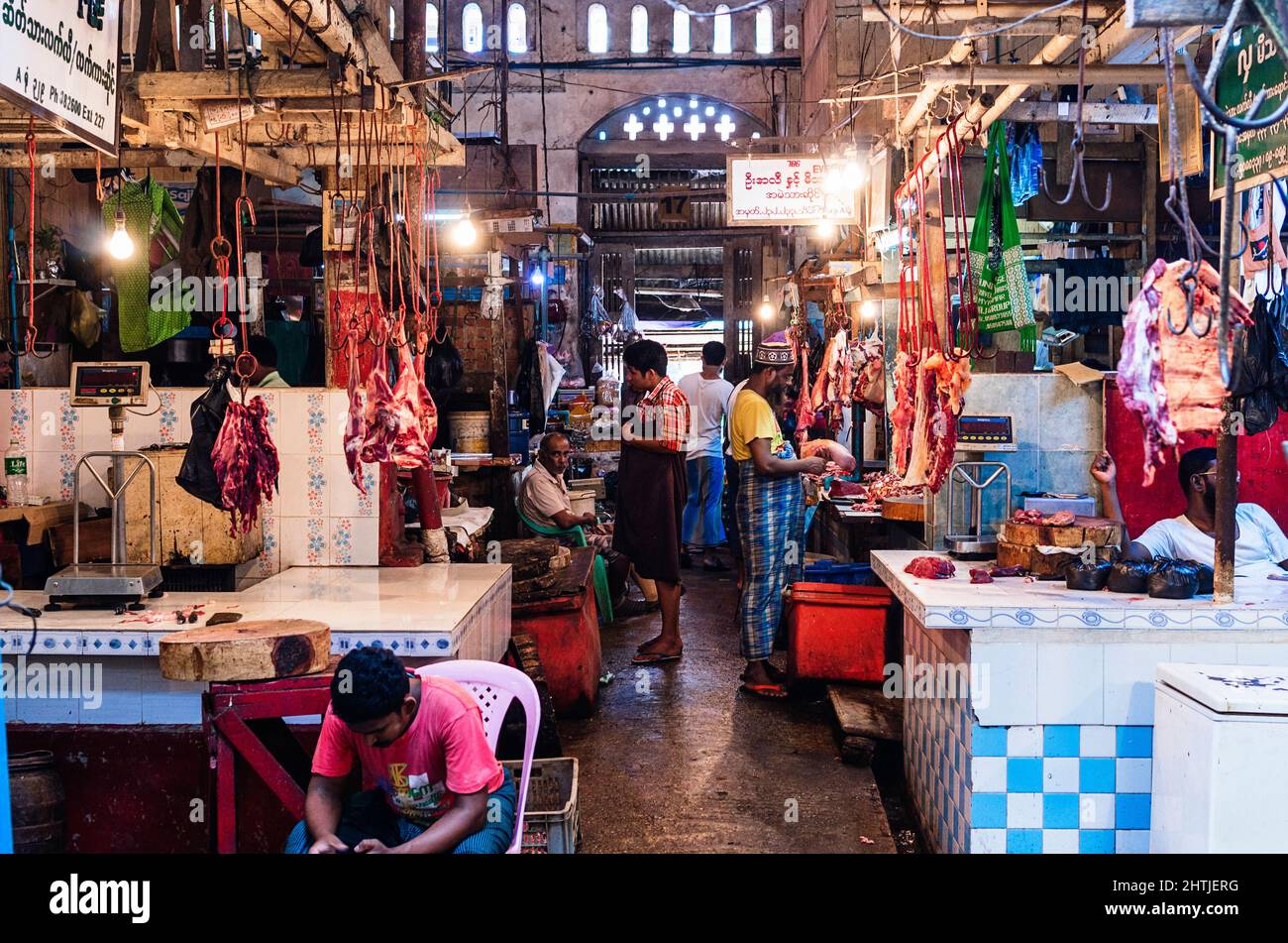 MYANMAR - APRIL 10, 2017: Side view of unrecognizable ethnic sellers ...