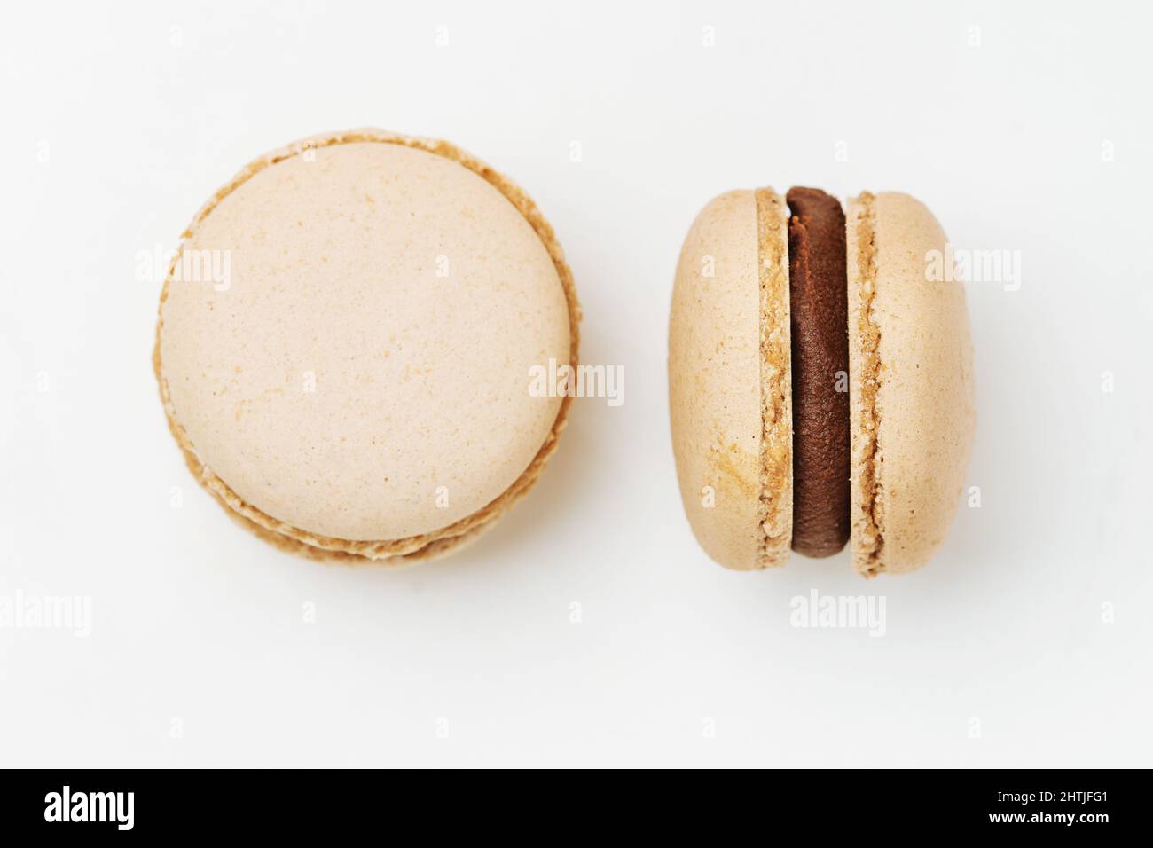 From above coffee flavored macaroons with sweet filling served on white ...