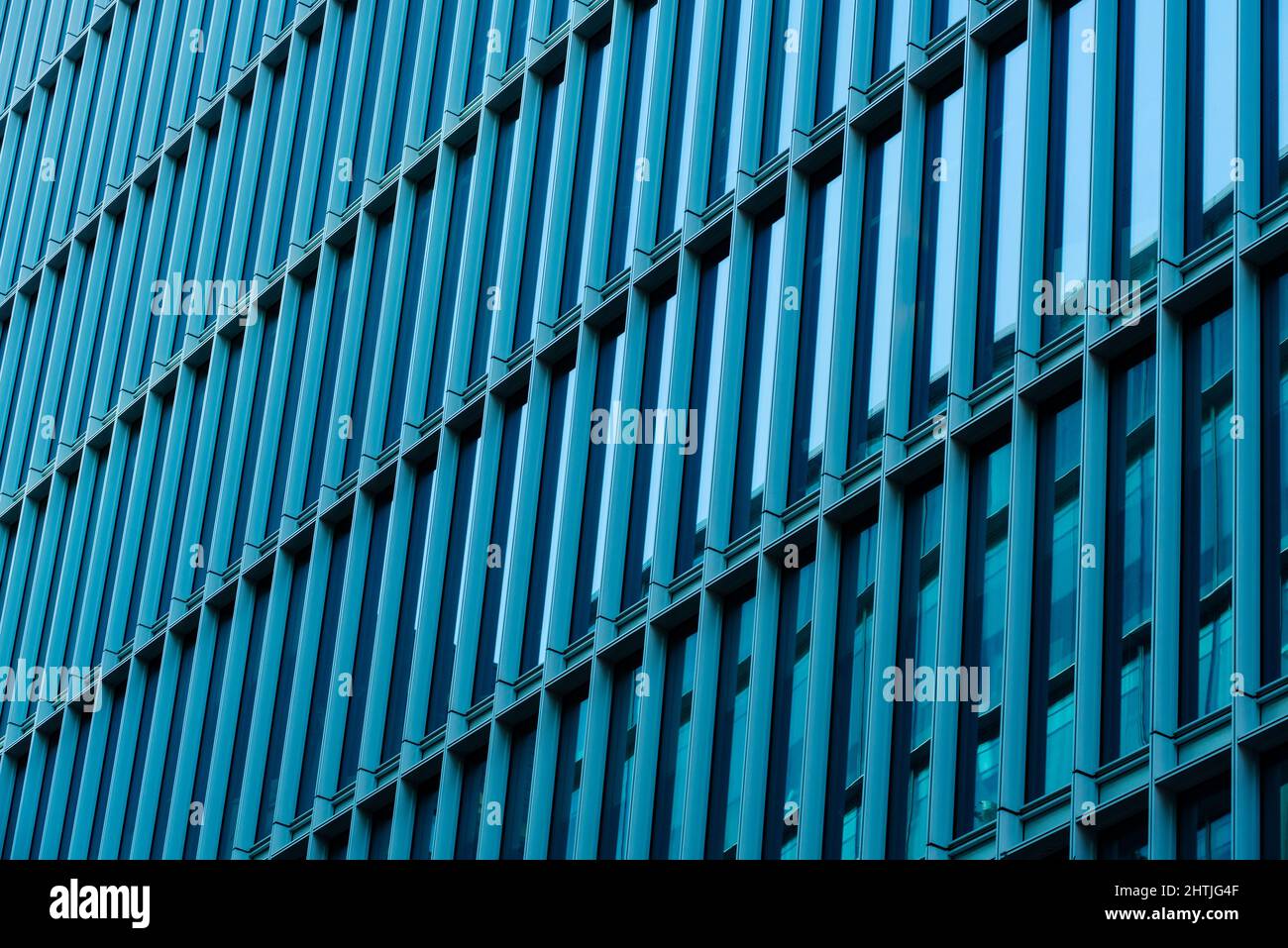 Modern architecture. Commercial real estate in the city. Blue coated ...