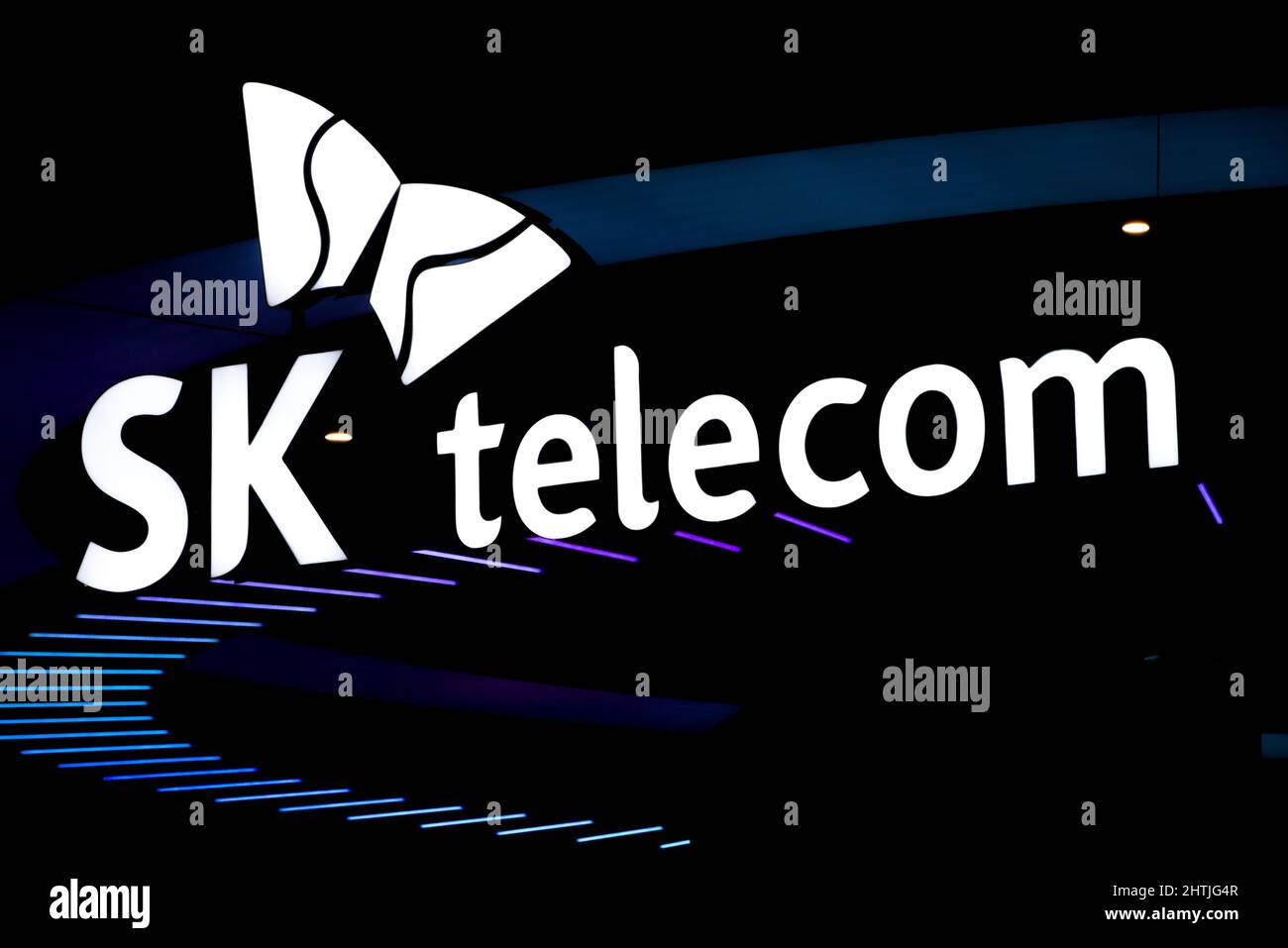 Barcelona, Spain. , . The SK telecom logo sits illuminated outside a ...