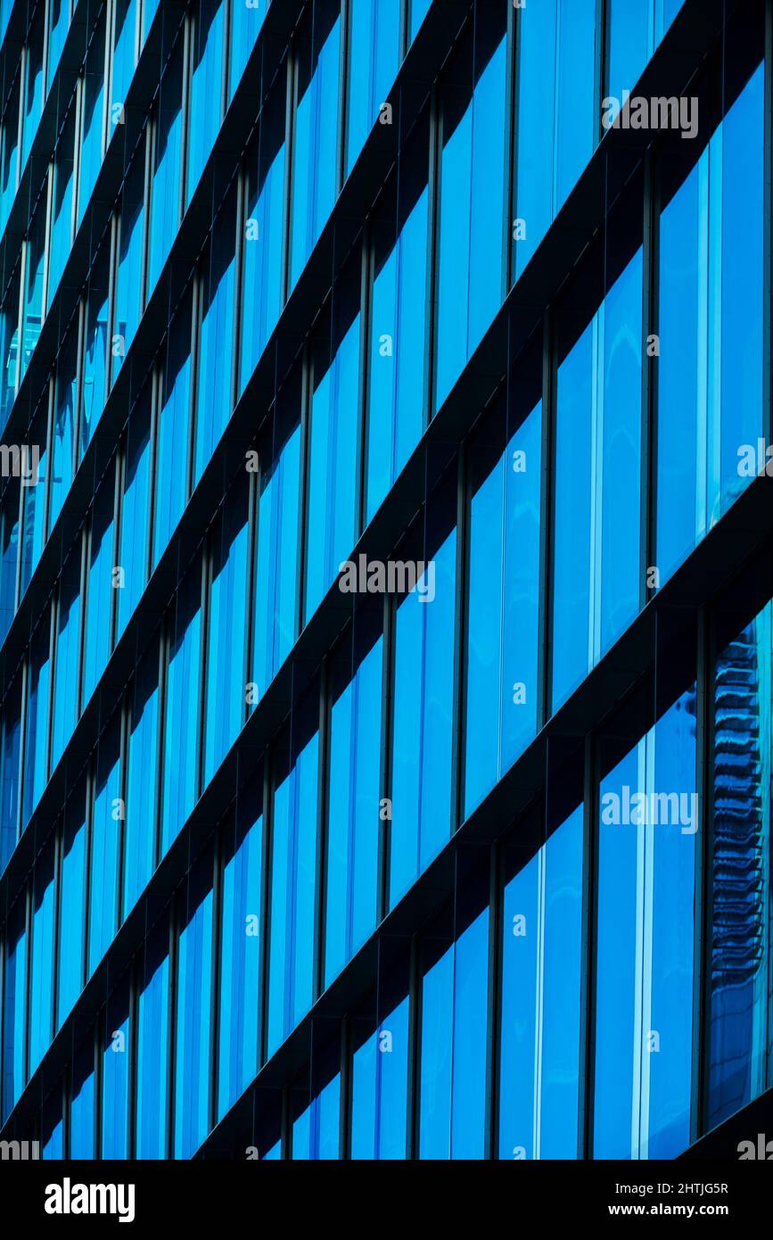 Modern architecture. Commercial real estate in the city. Blue coated ...