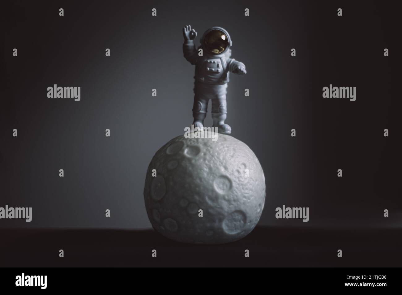 Astronaut and the Moon toys Stock Photo - Alamy