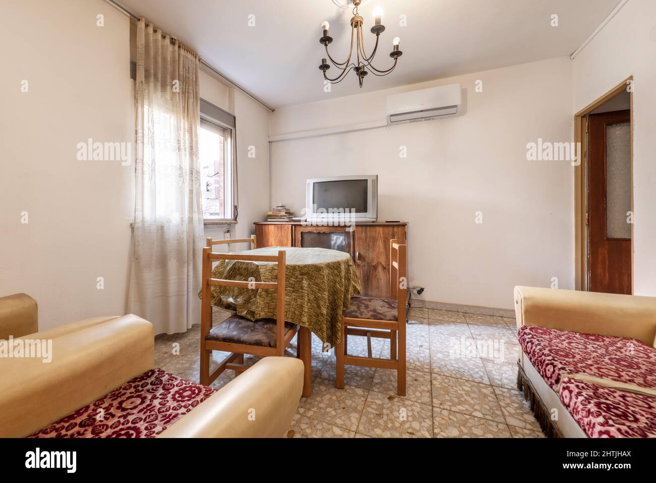 Vintage room with a stretcher table in the center and sofas with ...