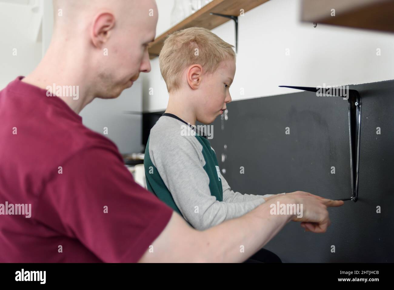 Son helping father home improvement hi-res stock photography and images ...