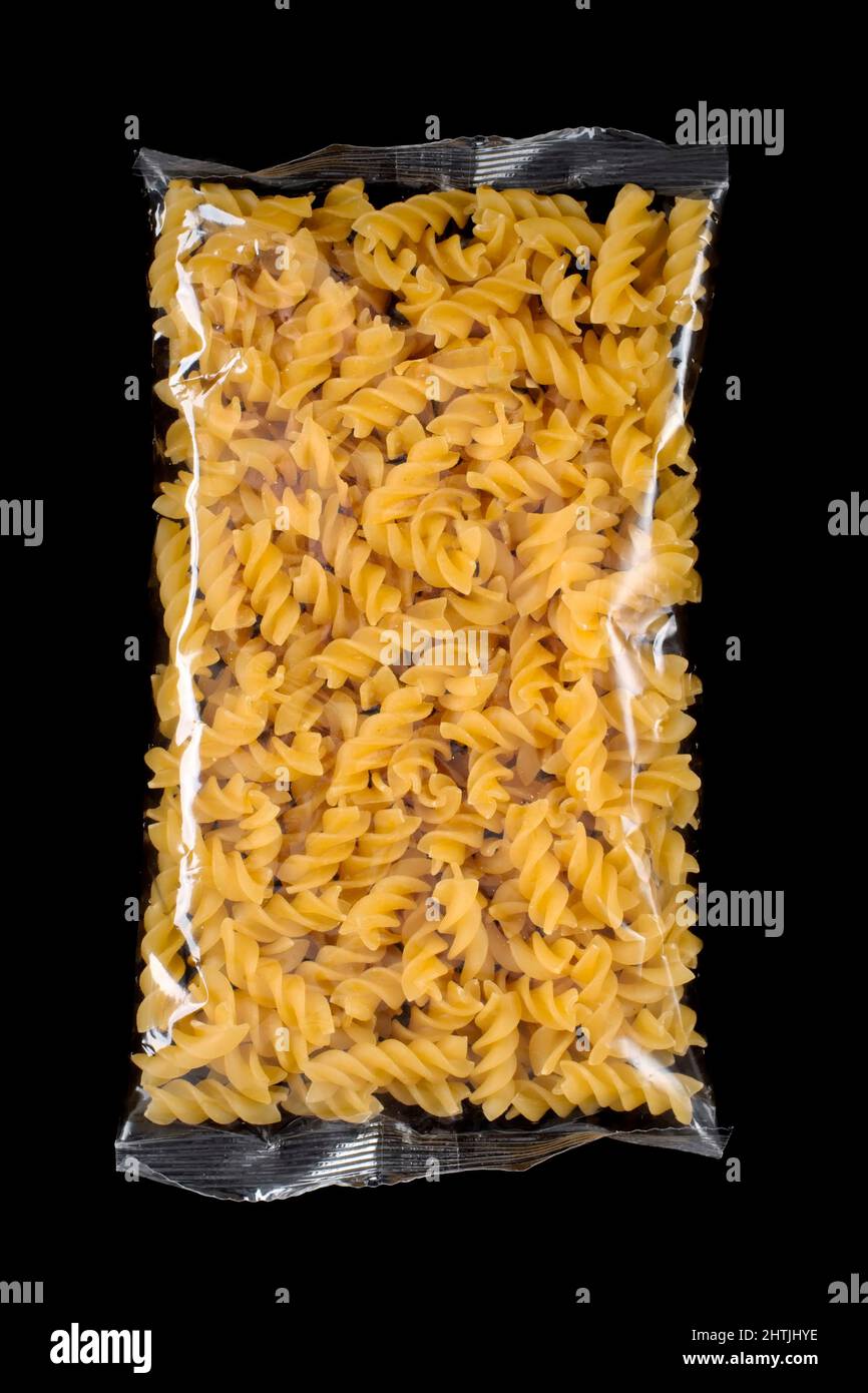 Fusili pasta in plastic package isolated in black background Stock ...