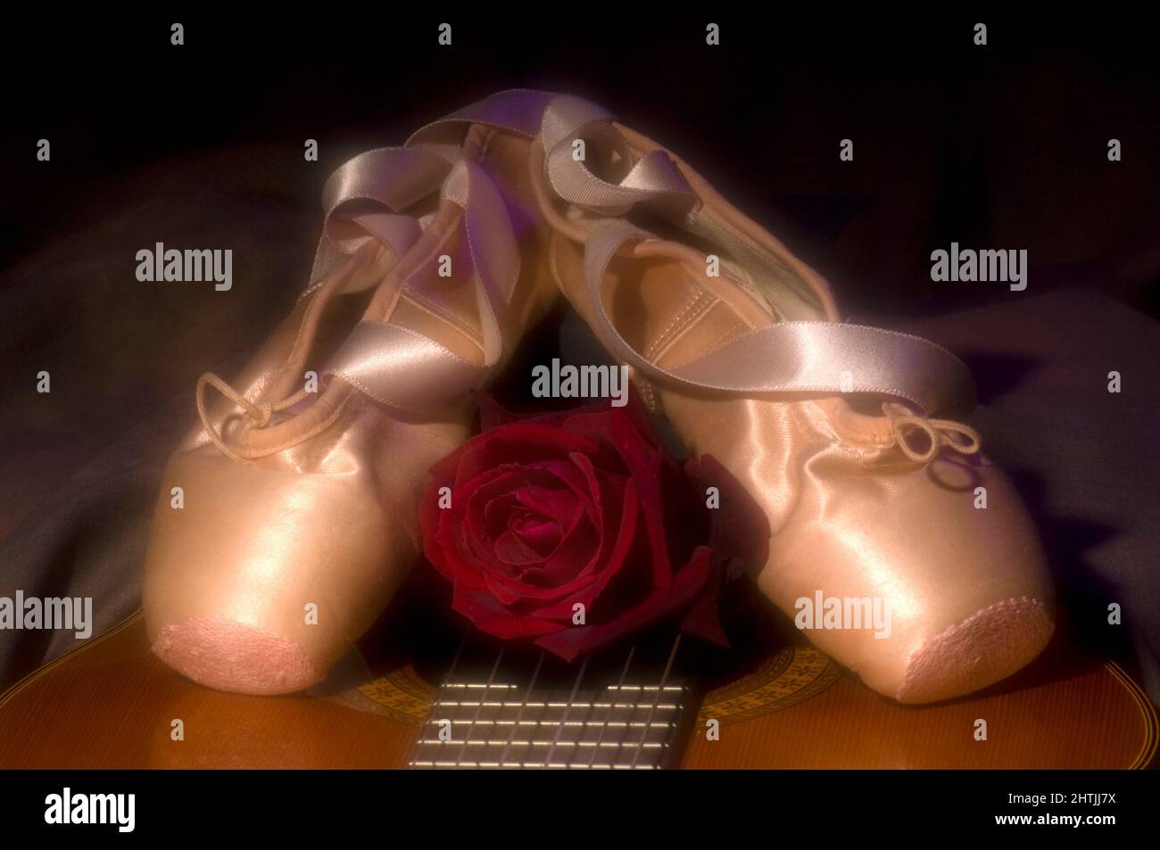 Pink Satin Pointe Ballet Shoes Red Rose Guitar Stock Photo - Alamy