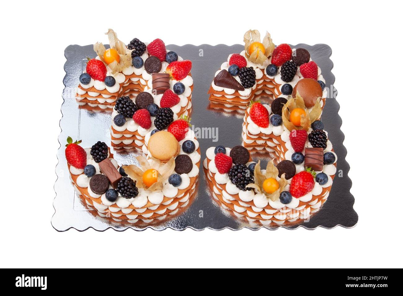 Creative birthday cake made of numbers thirty three from fruits and ...