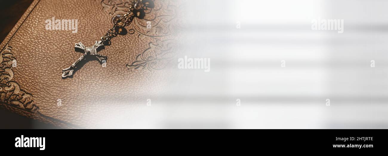 Close up view of rosary on holy bible with copy space Stock Photo - Alamy