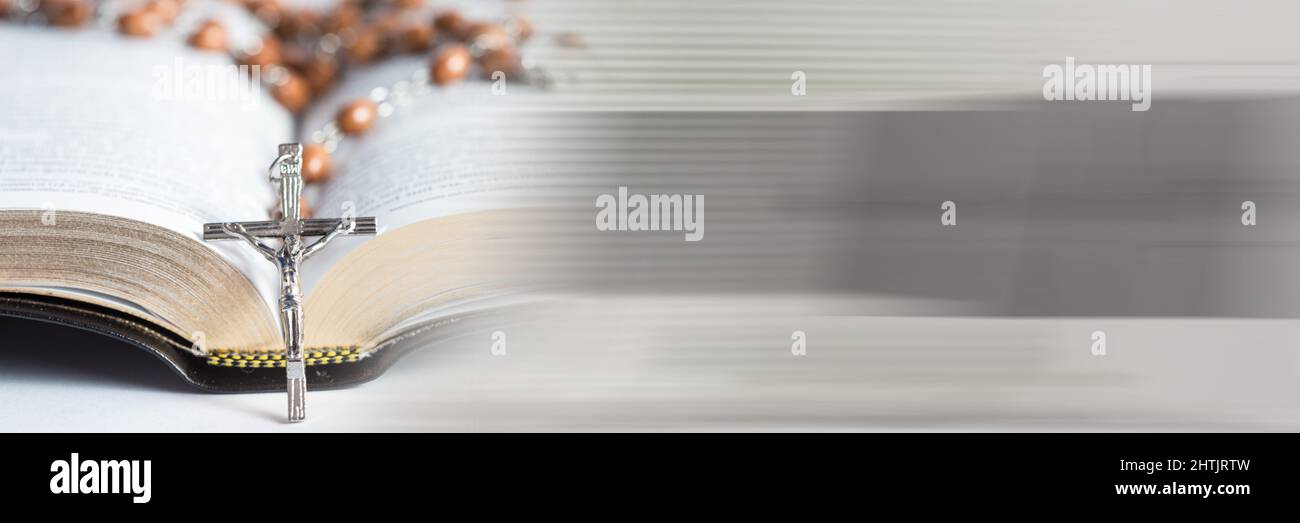 Close up view of rosary on open holy bible with copy space Stock Photo ...